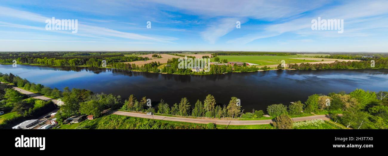 Aerial panoramic view of river Kymijoki bank with beautiful wooden ...