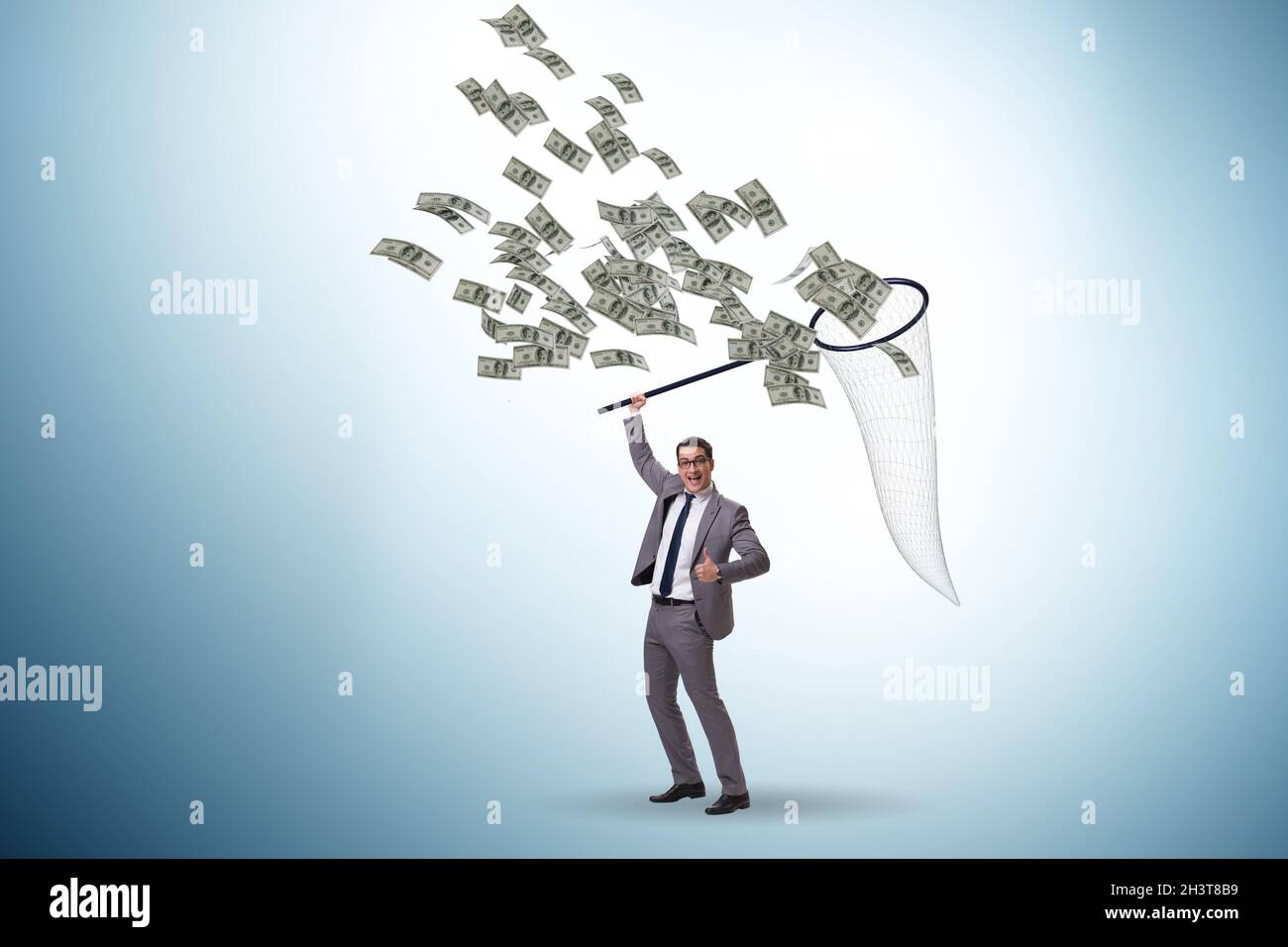 Young businessman catching dollars with landing net Stock Photo - Alamy