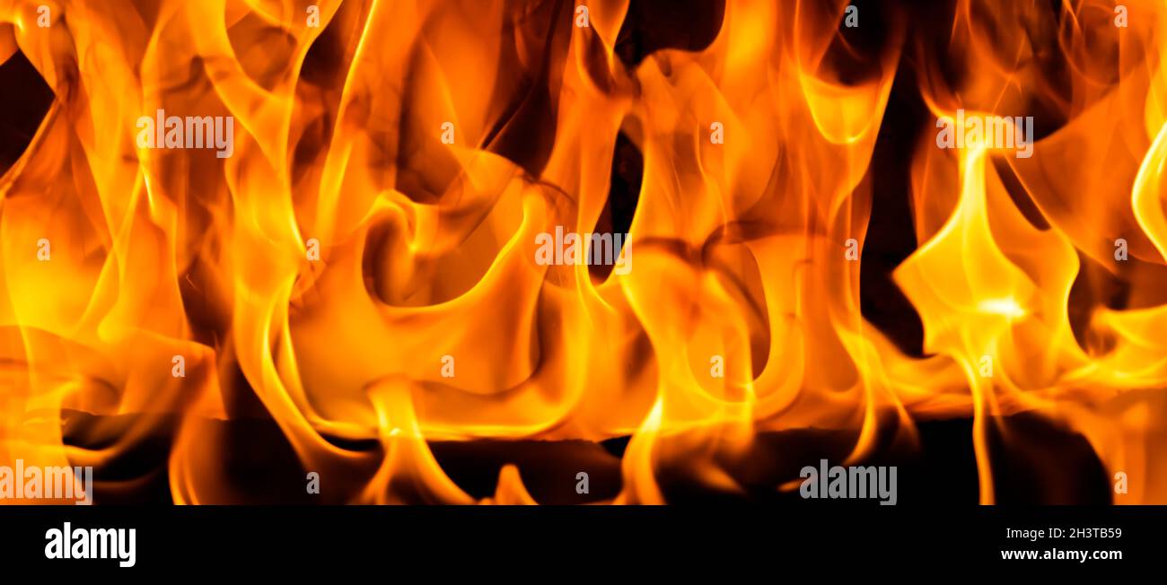 Red blaze Fire flame on a black background Stock Photo - Alamy