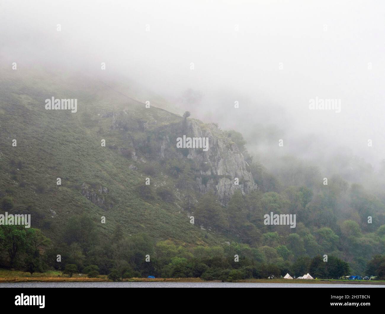 Low lying mist surrounding Llyn Gwynant in the Gwynant Valley ...