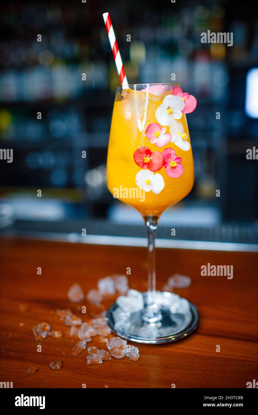 Yellow alcoholic cocktail on a bar counter in a bar Stock Photo - Alamy