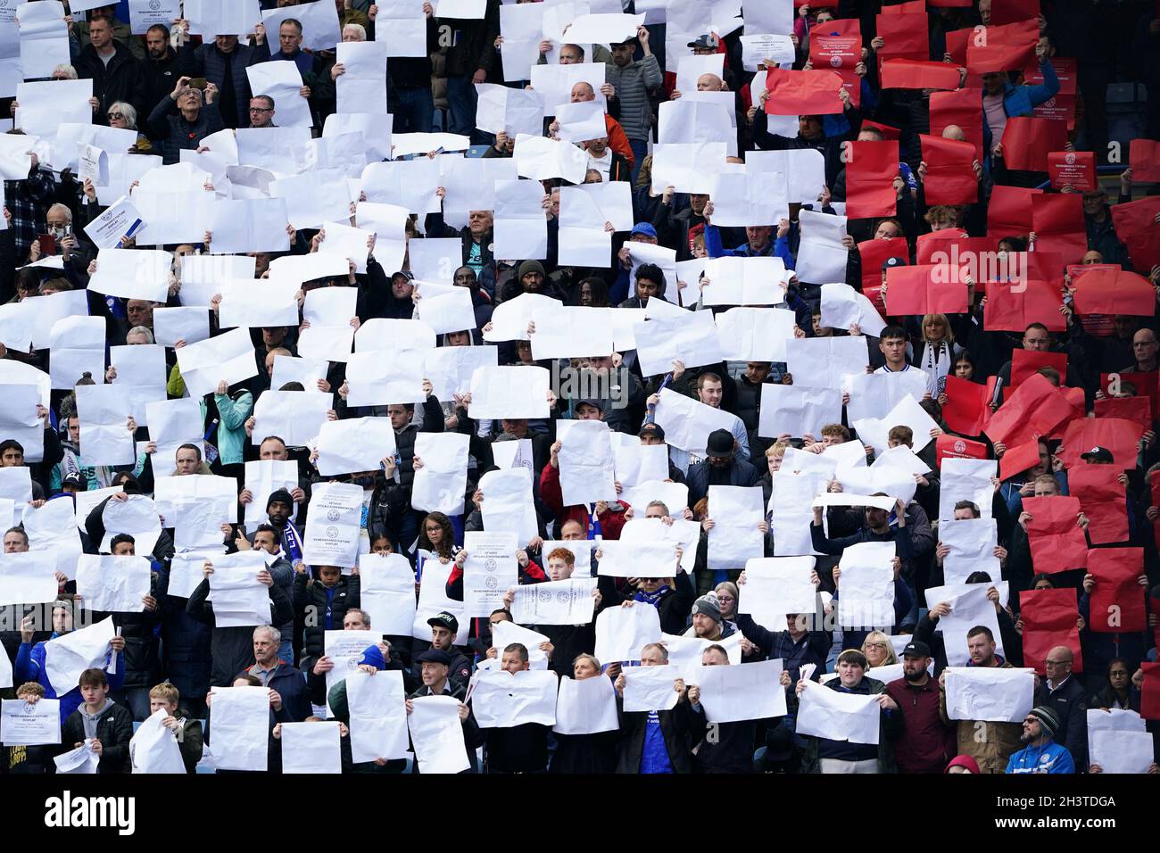 Arsenal fans hold cards in the form of a poppy during a minute's ...