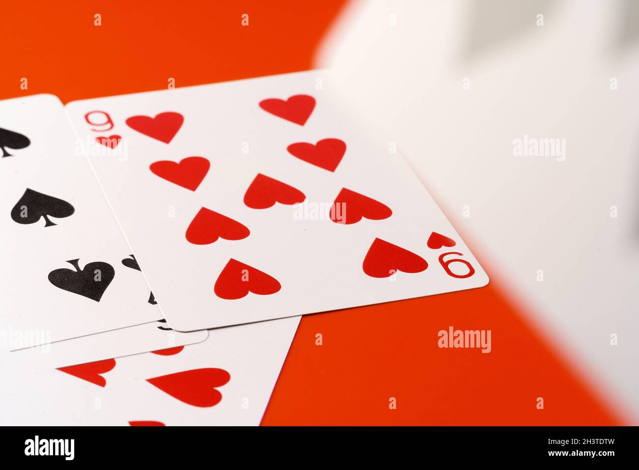 Playing cards on paper background close up Stock Photo - Alamy