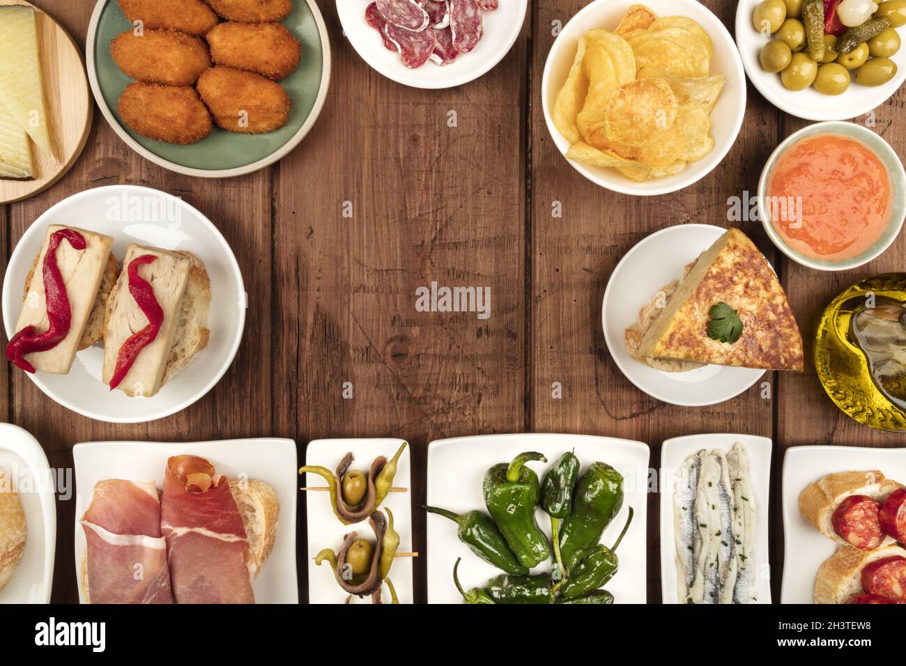 The food of Spain. Overhead photo of many different Spanish tapas with ...