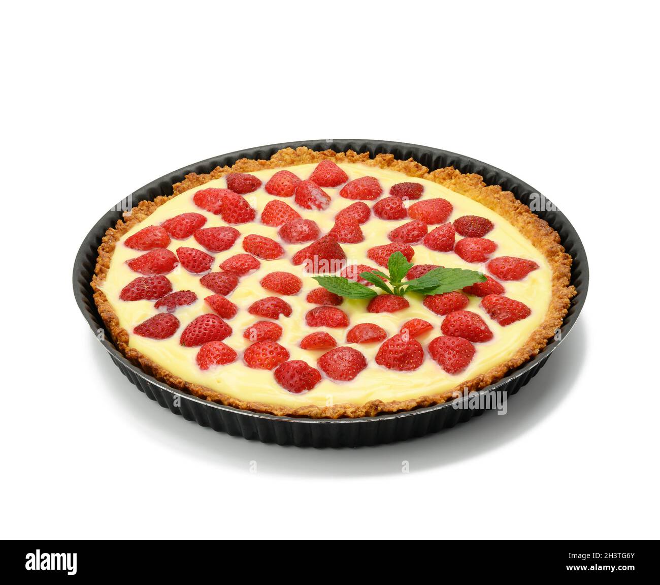 Baked round tart with strawberries and tender milk cream isolated on ...