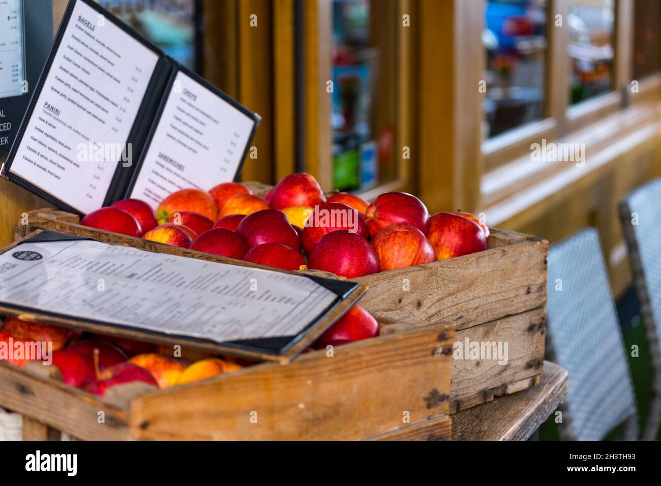 crate of apples outside a cafe Stock Photo - Alamy
