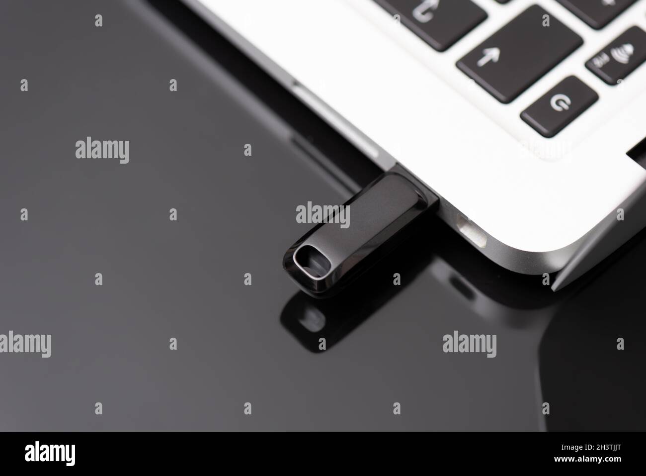 USB flash drive connected to the laptop's USB socket. Pen drive, flash ...