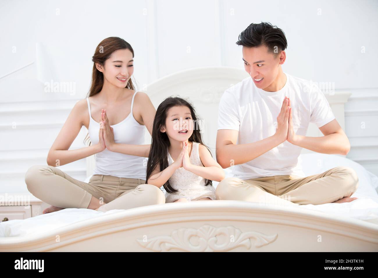Warm and loving family of three Stock Photo - Alamy
