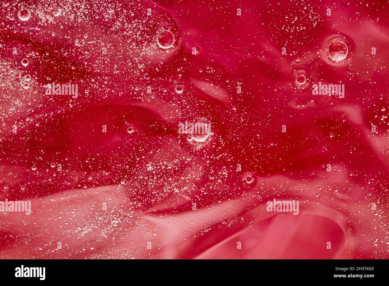 Abstract red liquid background, paint splash, swirl pattern and water ...