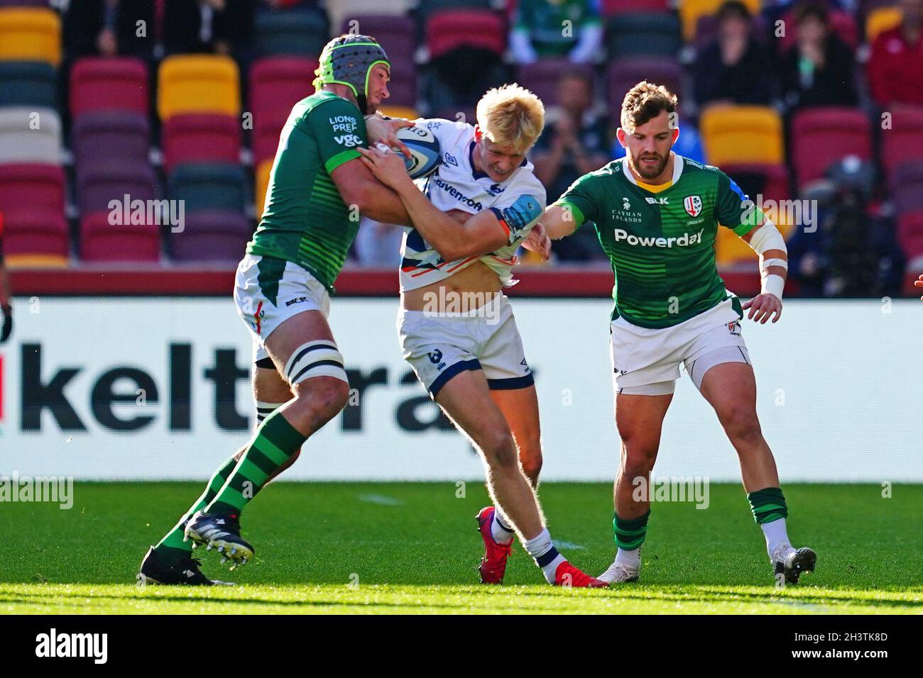 Bristol Bear's Toby Fricker (centre) is tackled by London Irish's Rob ...