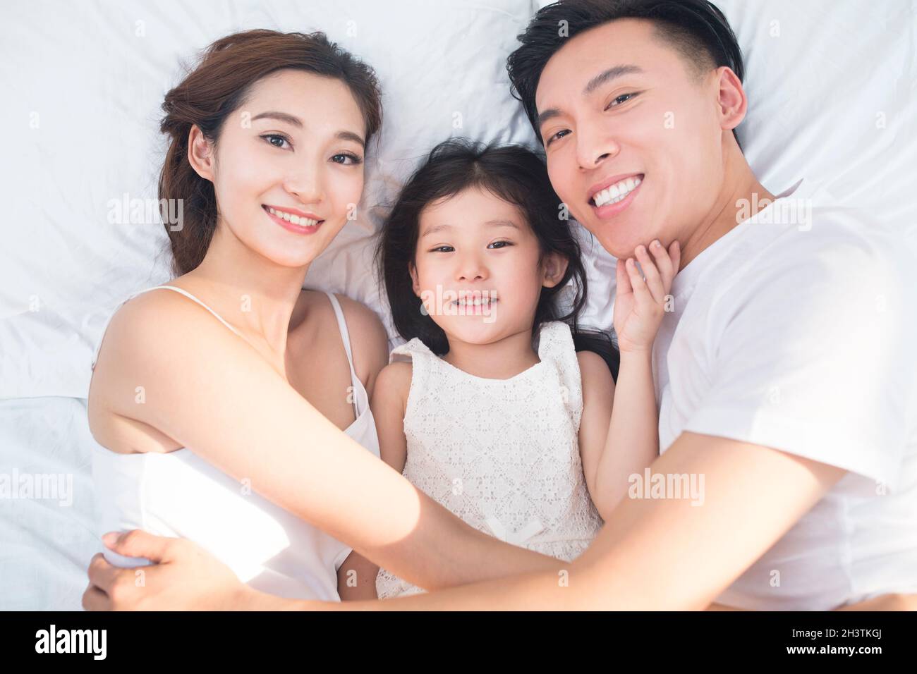 Warm and loving family of three Stock Photo - Alamy