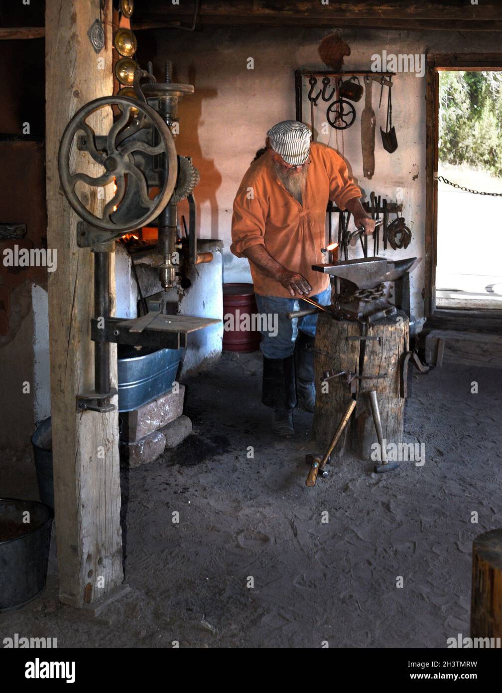 A blacksmith demonstrates how hardware was made in the 19th century at ...