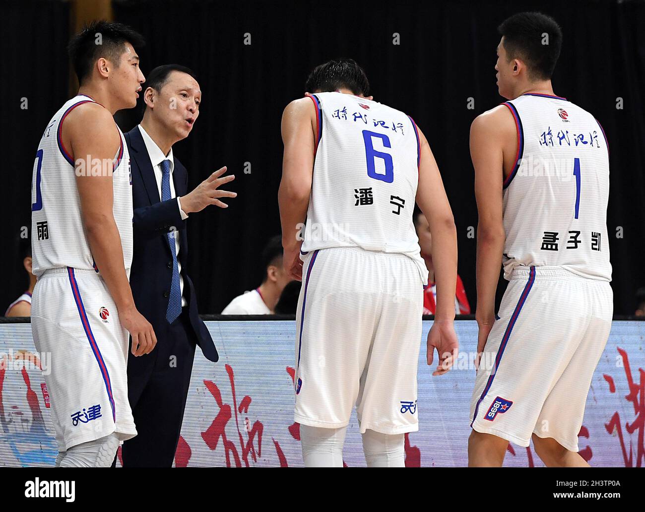 Zhuji, China. 30th Oct, 2021. Head coach Zhang Degui (2nd L) of Tianjin ...