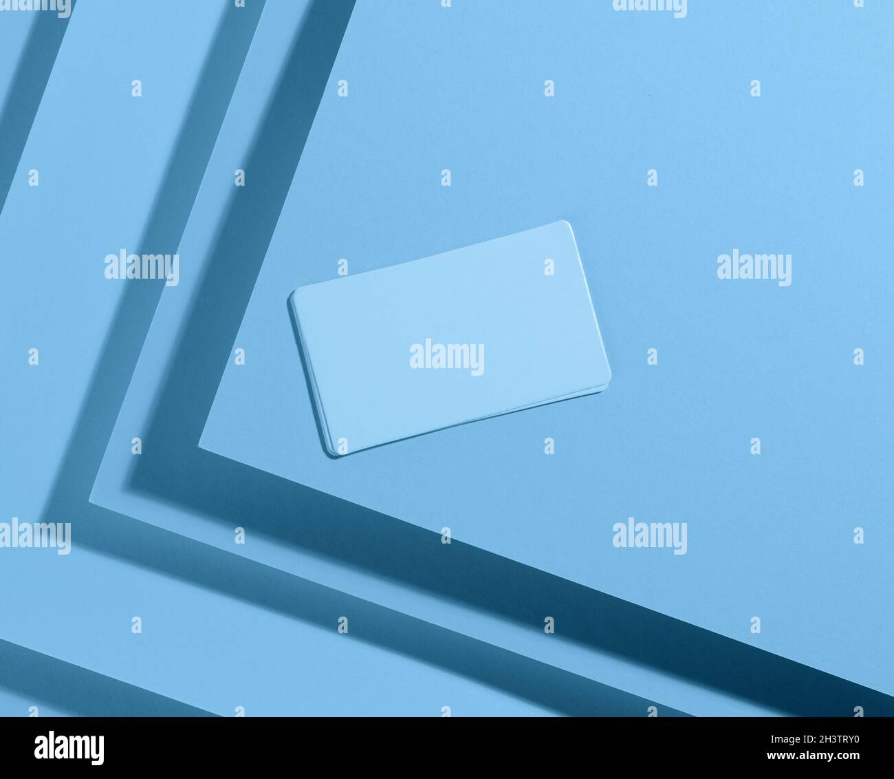 Blank rectangular business card on creative blue background from sheets ...