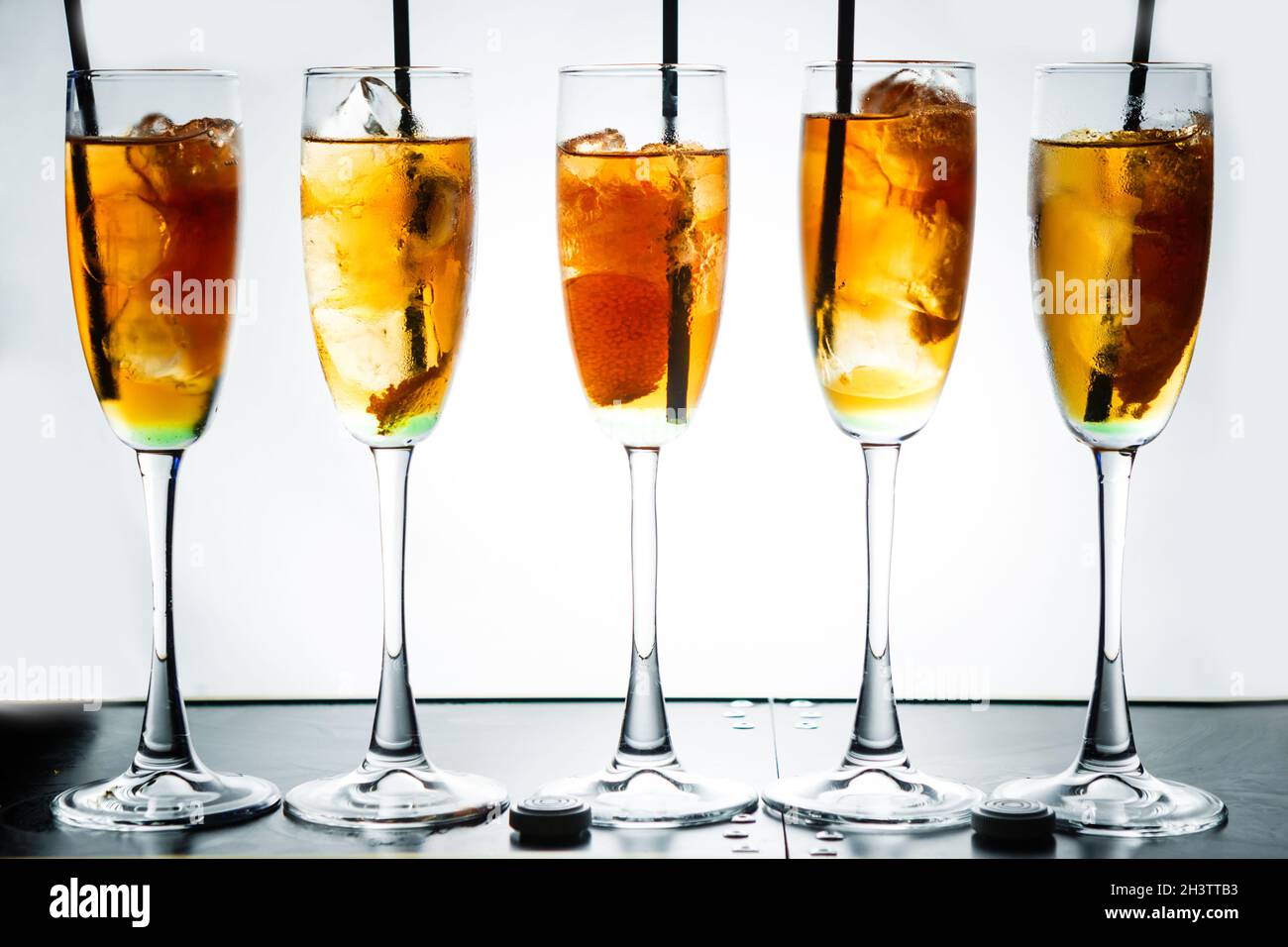 Yellow alcoholic cocktail on a bar counter in a bar Stock Photo - Alamy