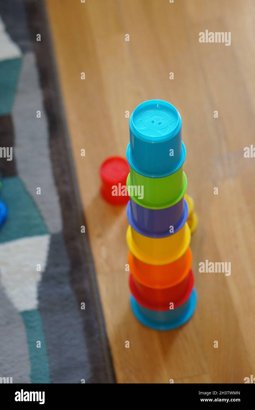Vertical shot of the toy plastic pyramid cups on the floor Stock Photo ...