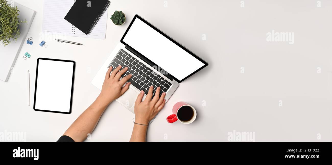 Overhead view man using computer laptop on white background Stock Photo ...