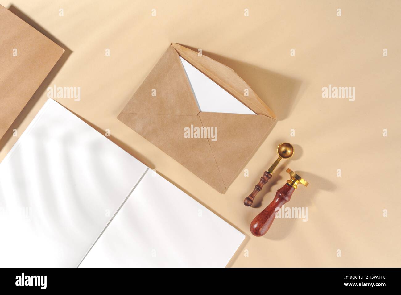 Craft paper letter on beige background top view Stock Photo - Alamy