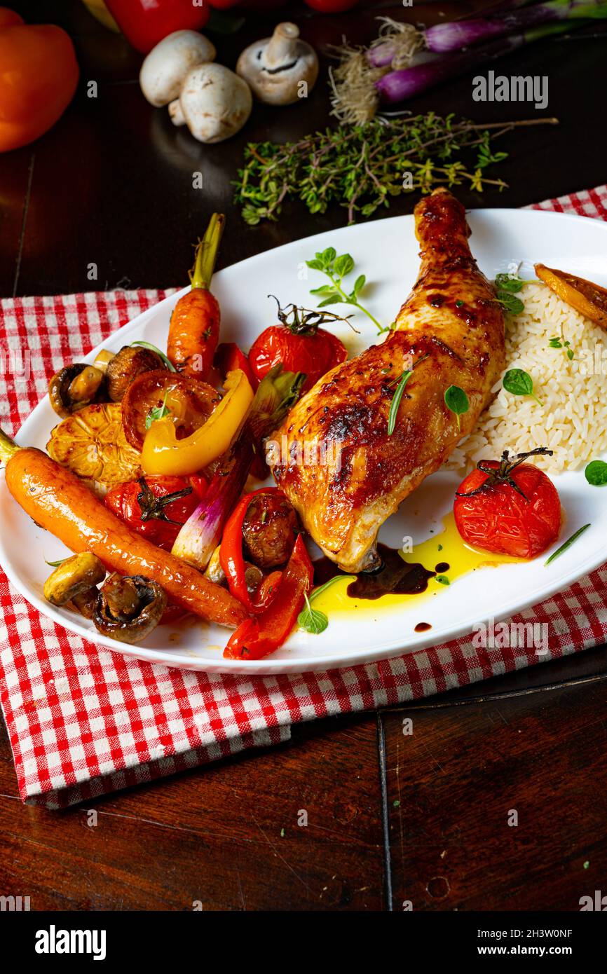 Rustic fried chicken legs with assorted vegetables and rice Stock Photo ...