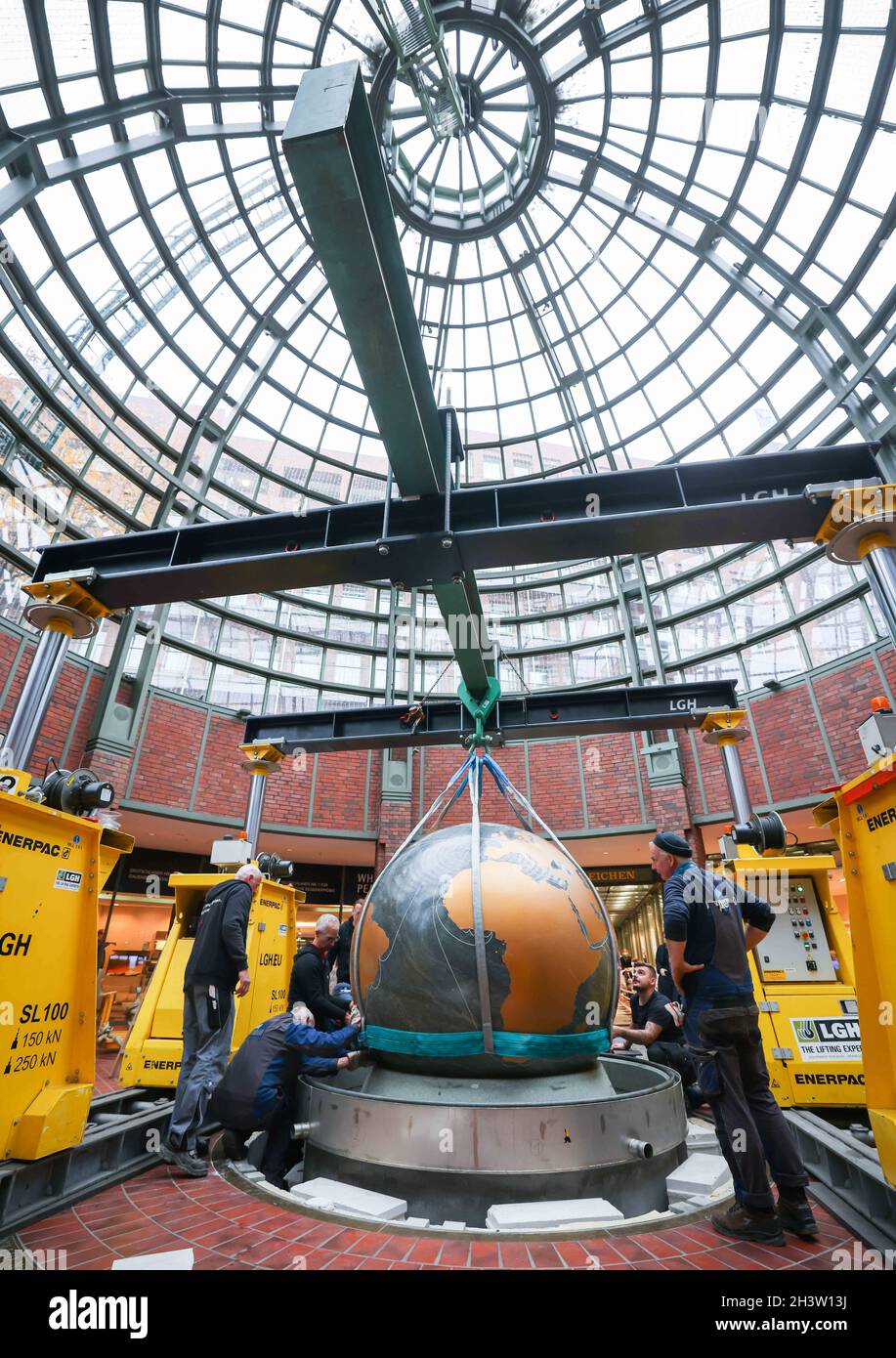 Hamburg, Germany. 30th Oct, 2021. Experts use a hoist crane to lift the ...