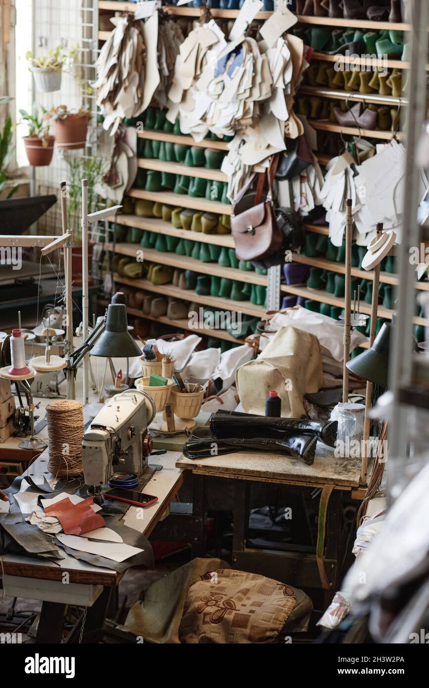 Image of workplace of tailor with sewing machine patterns and fabric on ...