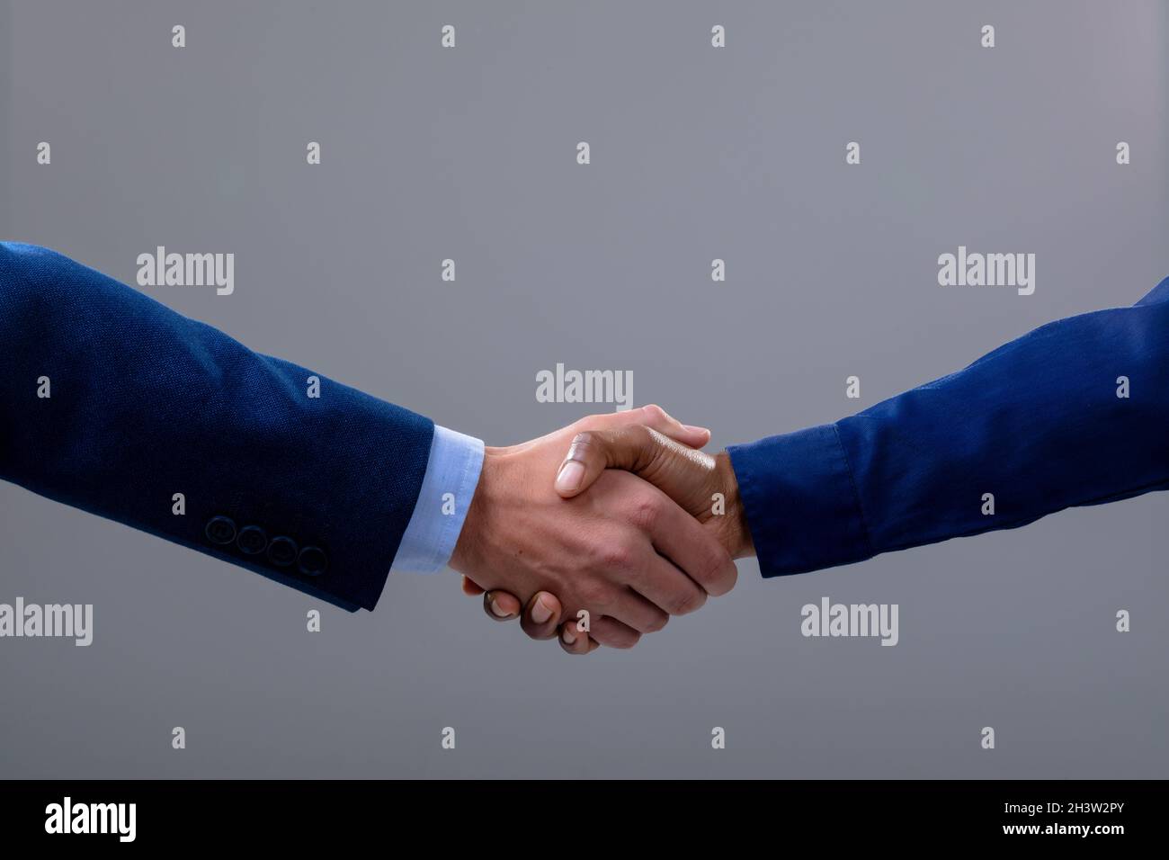 Caucasian and african american business people shaking hands, isolated ...