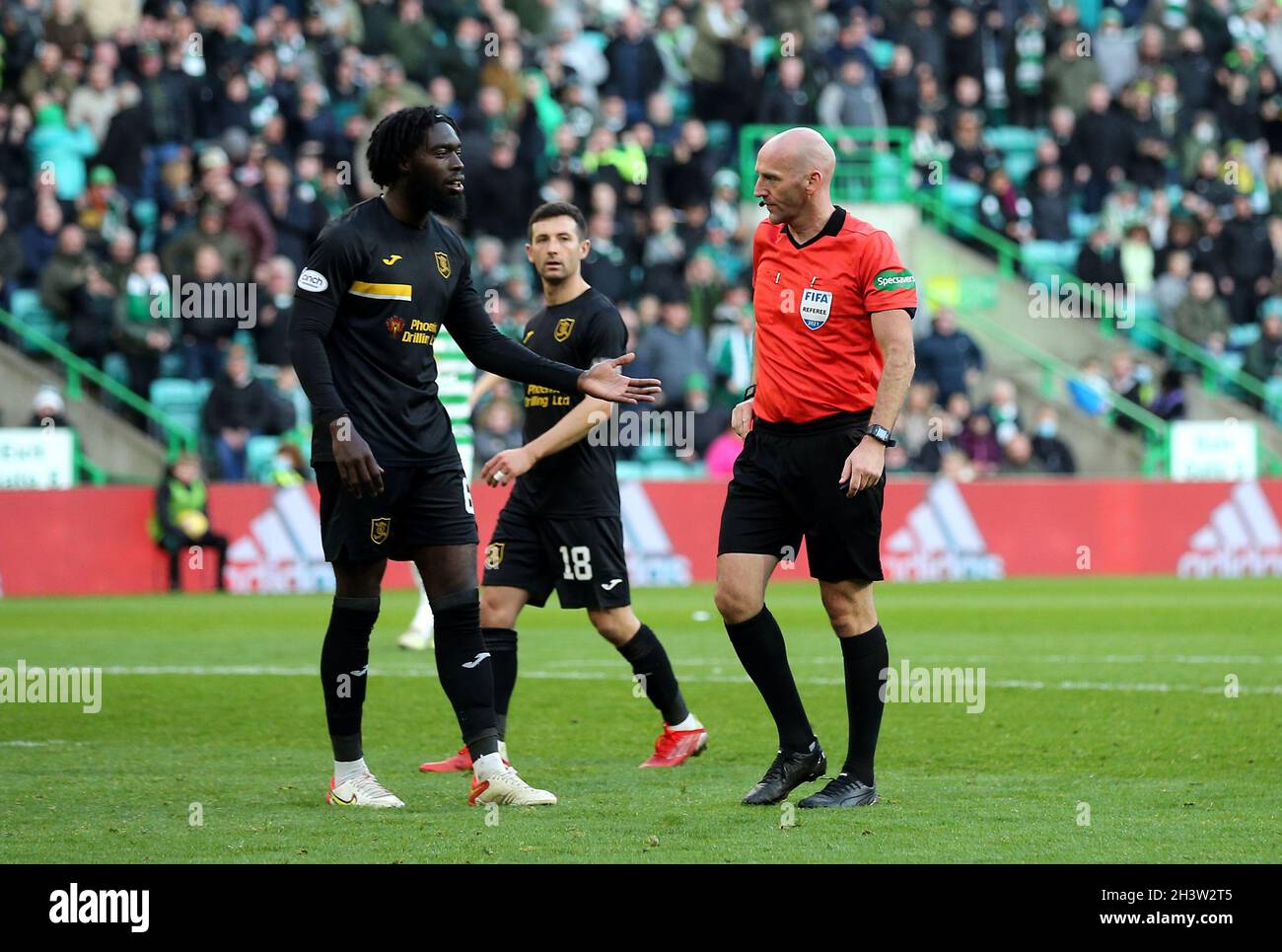 Referee Bobby Madden sends off Livingston's Ayo Obileye after an ...