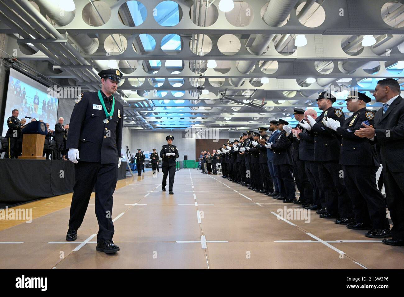 New York, USA. 29th Oct, 2021. An NYPD officer reacts emotionally after ...