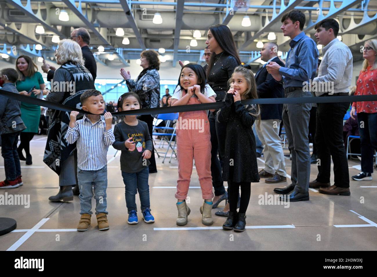 New York, USA. 29th Oct, 2021. Stephanie Liu (pink), 6, jumps with joy ...