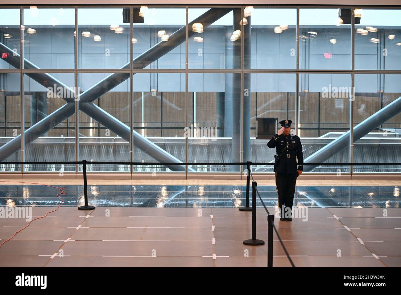 New York, USA. 29th Oct, 2021. An NYPD officer stands saluting at the ...