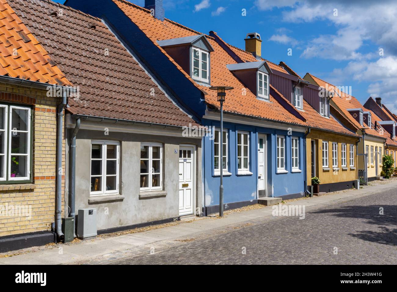 Colorful houses and cobblestone street in the historic old town of Koge ...