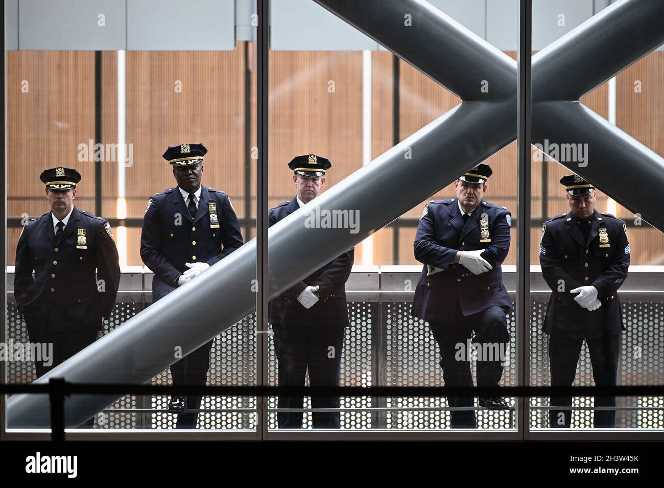 A group of NYPD officers who are to be honored stand outside the ...