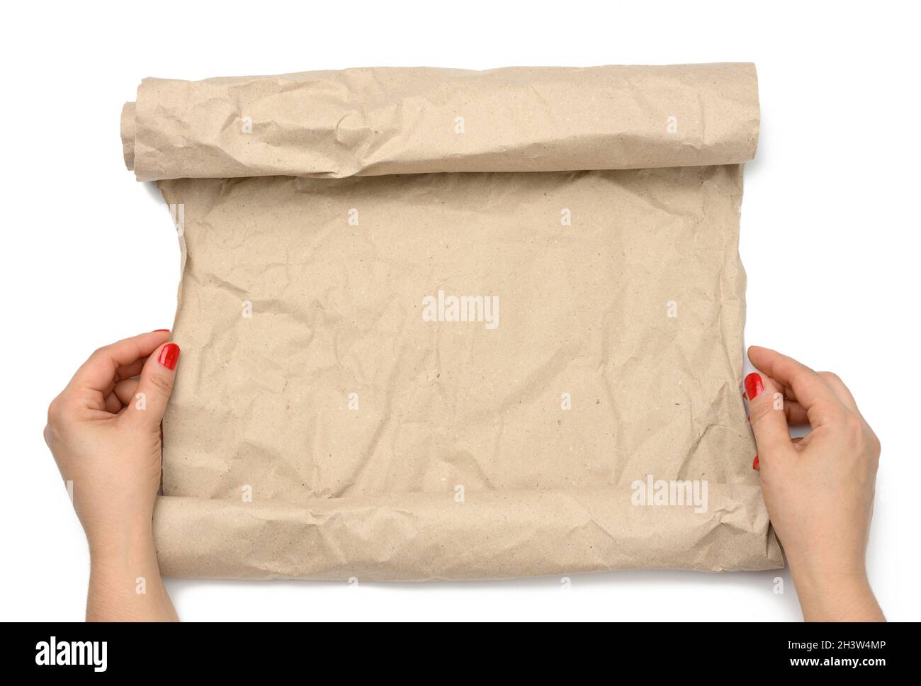 Female hands holding a rolled roll of brown crumpled paper isolated on ...