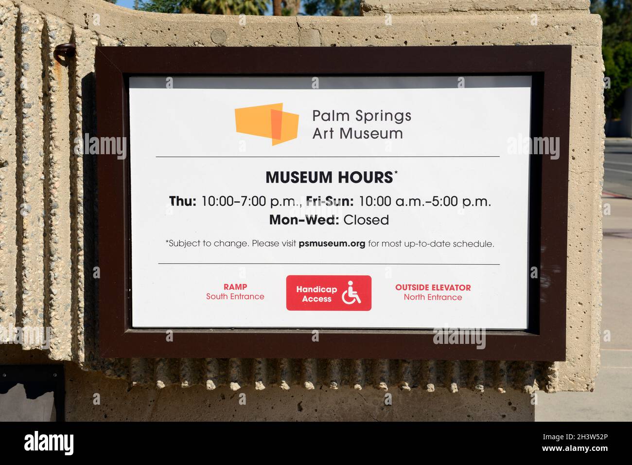 The museum hours sign outside the Palm Springs Museum of Art, CA Stock ...