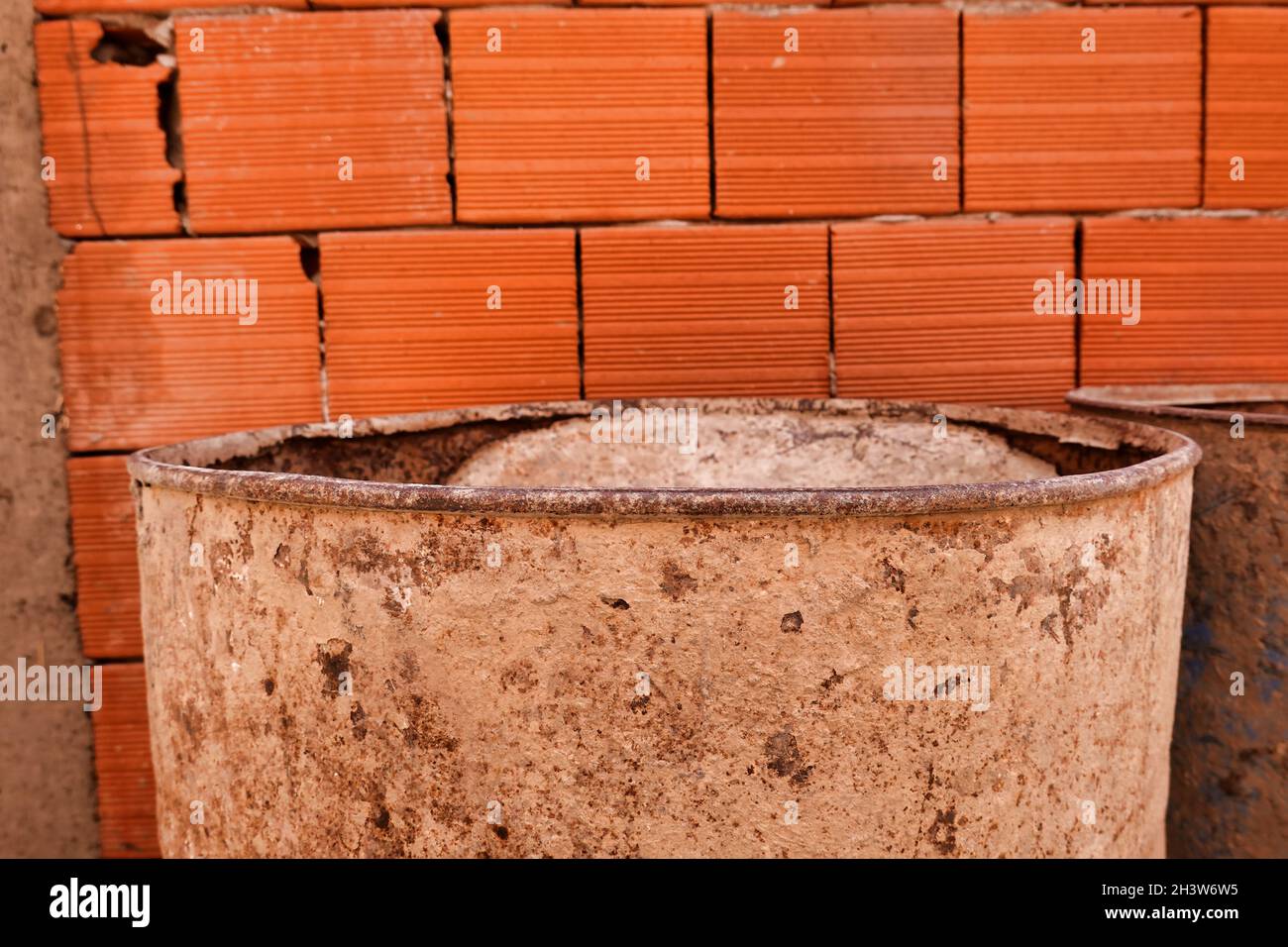Dirty bucket in an industrial area Stock Photo - Alamy
