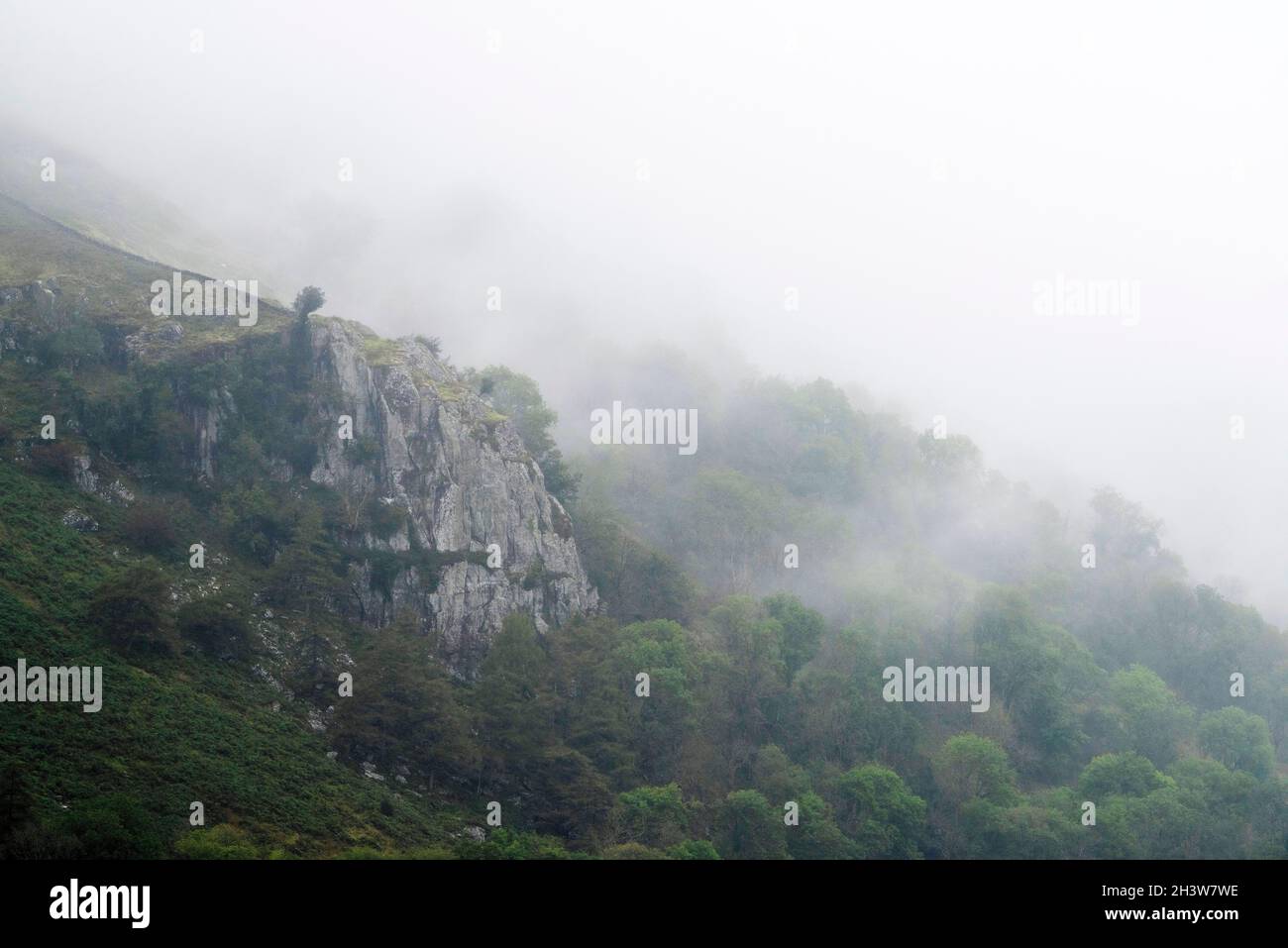 Low lying mist surrounding Llyn Gwynant in the Gwynant Valley ...