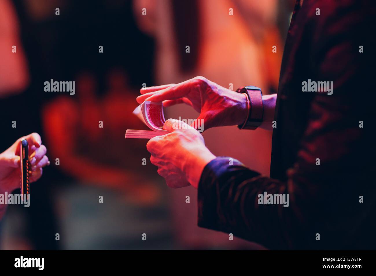 Magician shows guests card tricks At the party, top view Stock Photo ...
