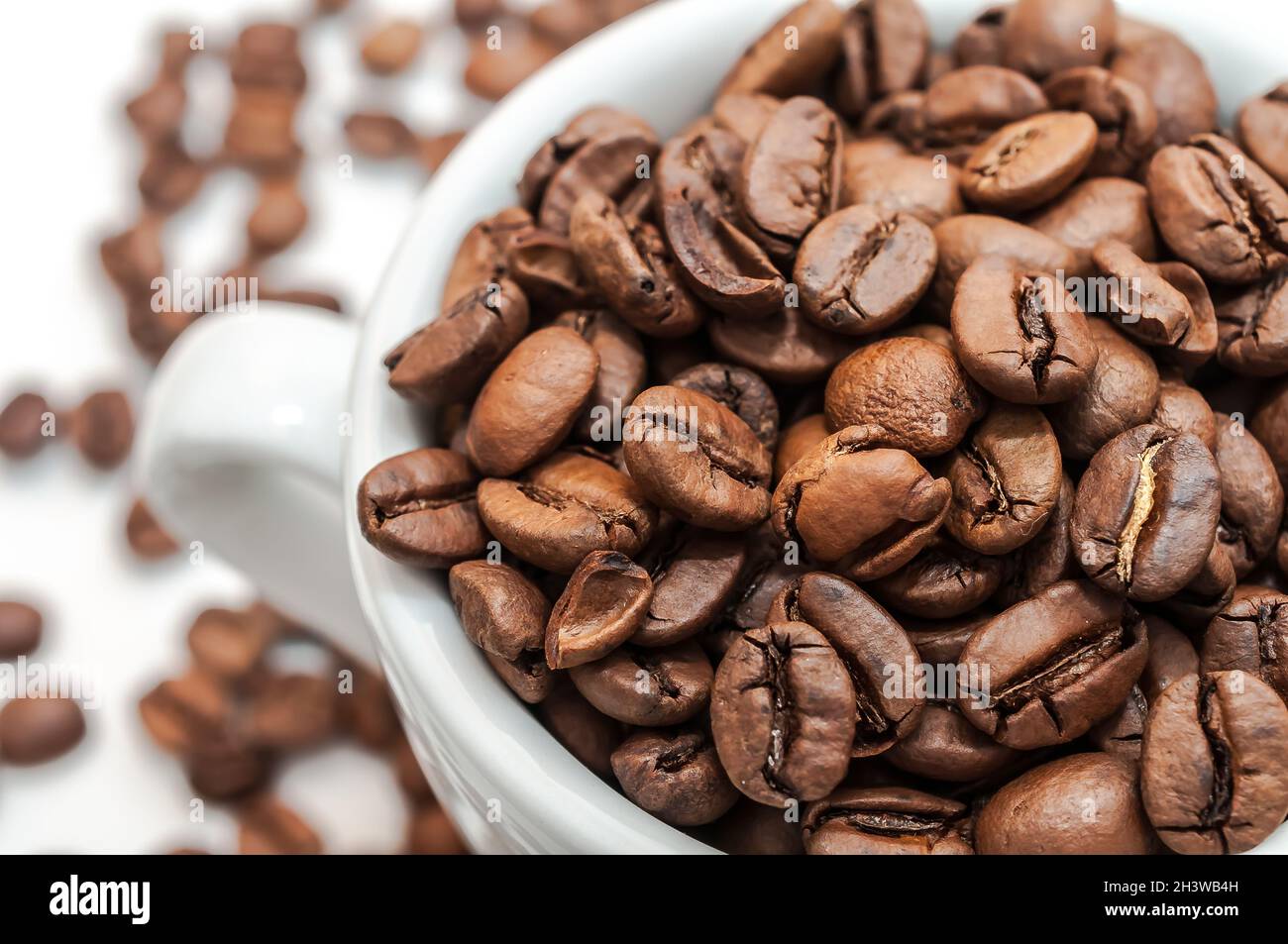 Roasted coffee beans in a cup Stock Photo - Alamy