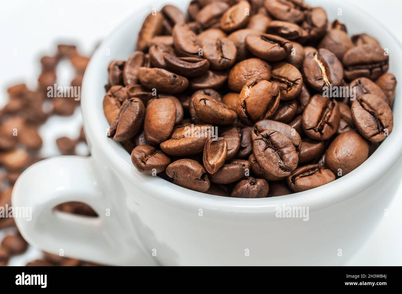 Roasted coffee beans in a cup Stock Photo - Alamy