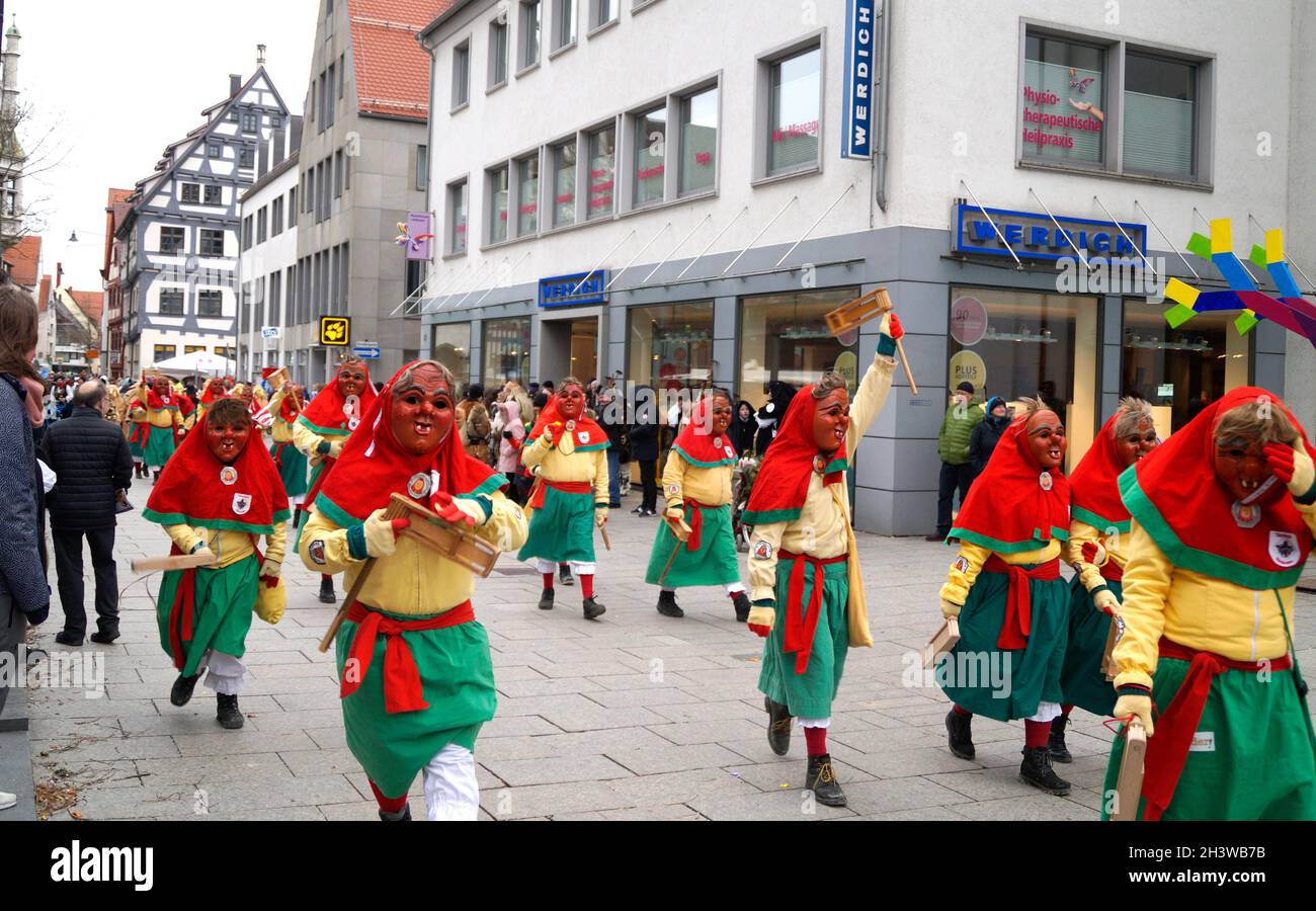 people dressed up in funny clothes and masks celebrating traditional ...