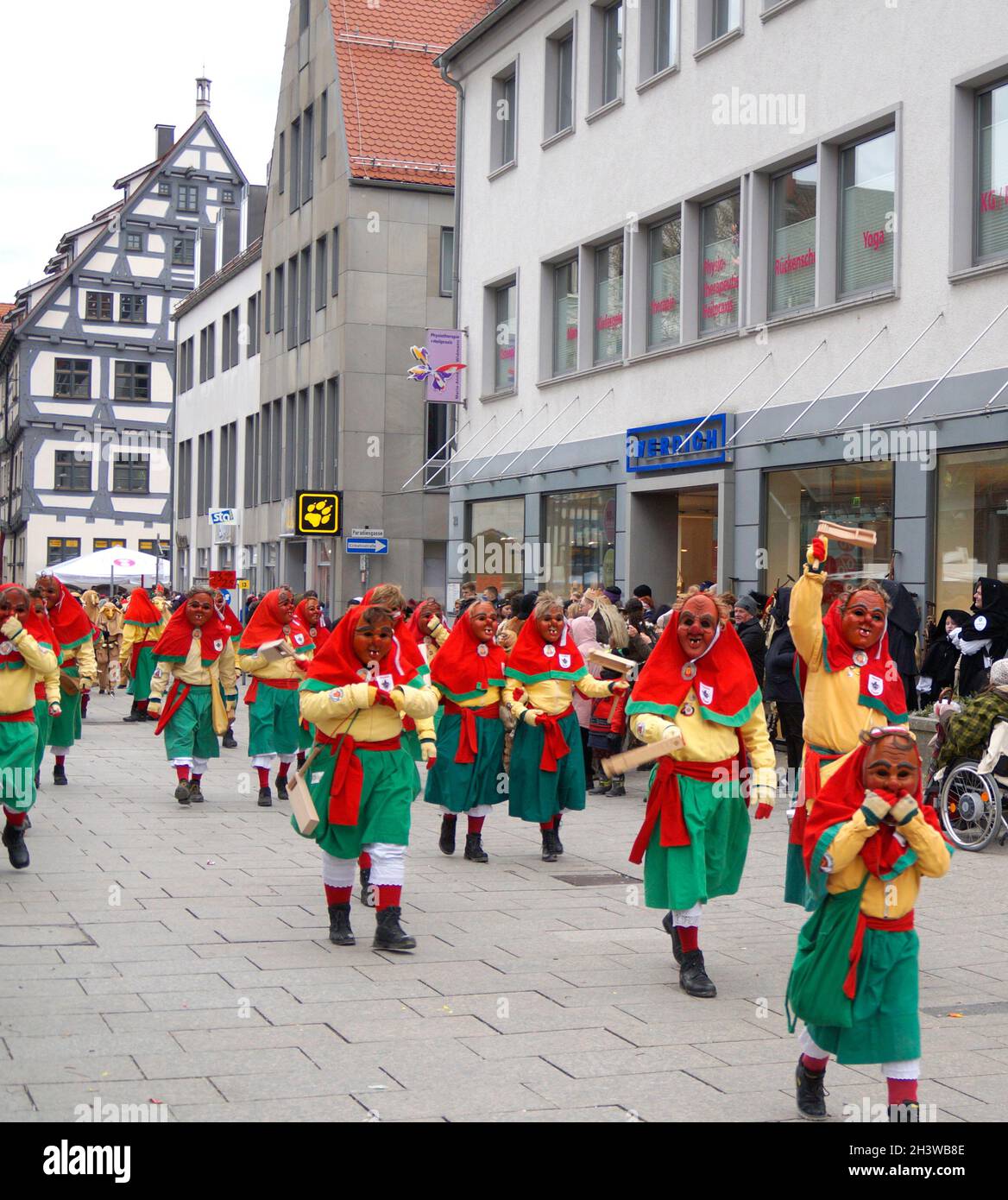 people dressed up in funny clothes and masks celebrating traditional ...
