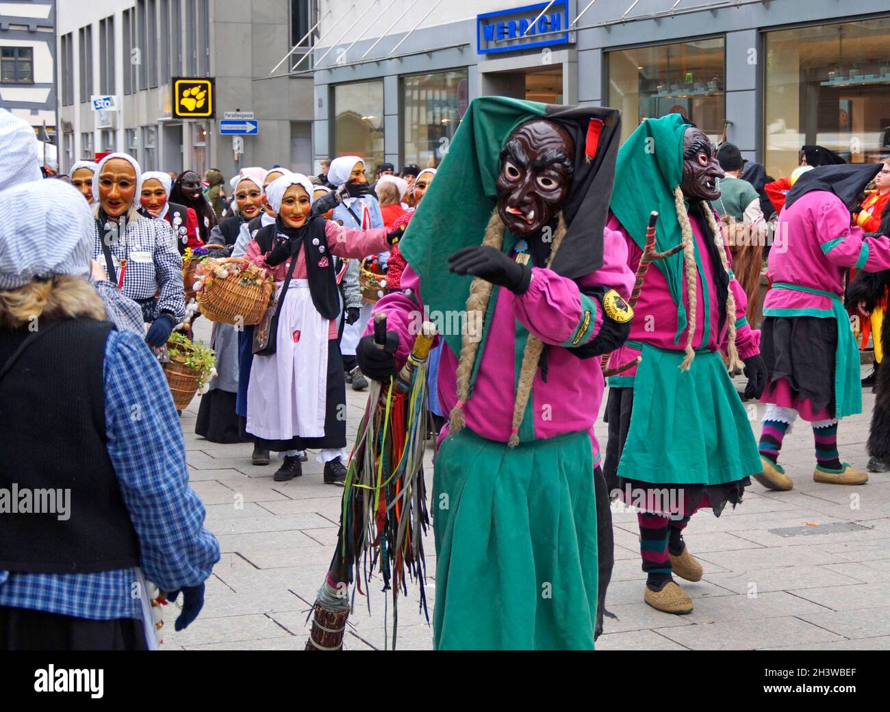 people dressed up in funny clothes and masks celebrating traditional ...