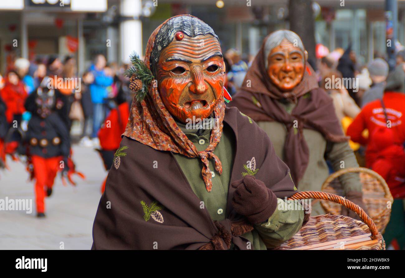 people dressed up in funny clothes and masks celebrating traditional ...