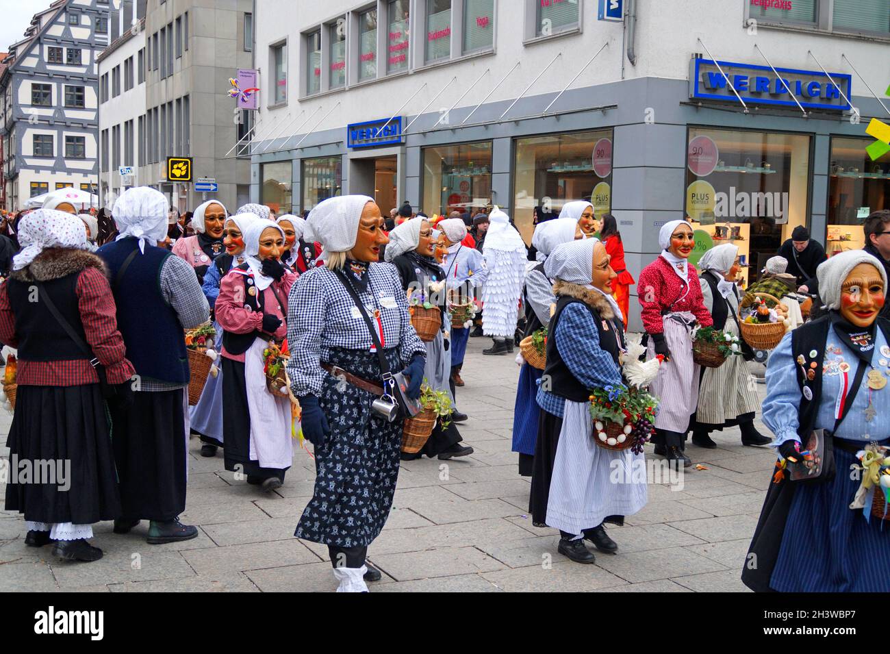 people dressed up in funny clothes and masks celebrating traditional ...