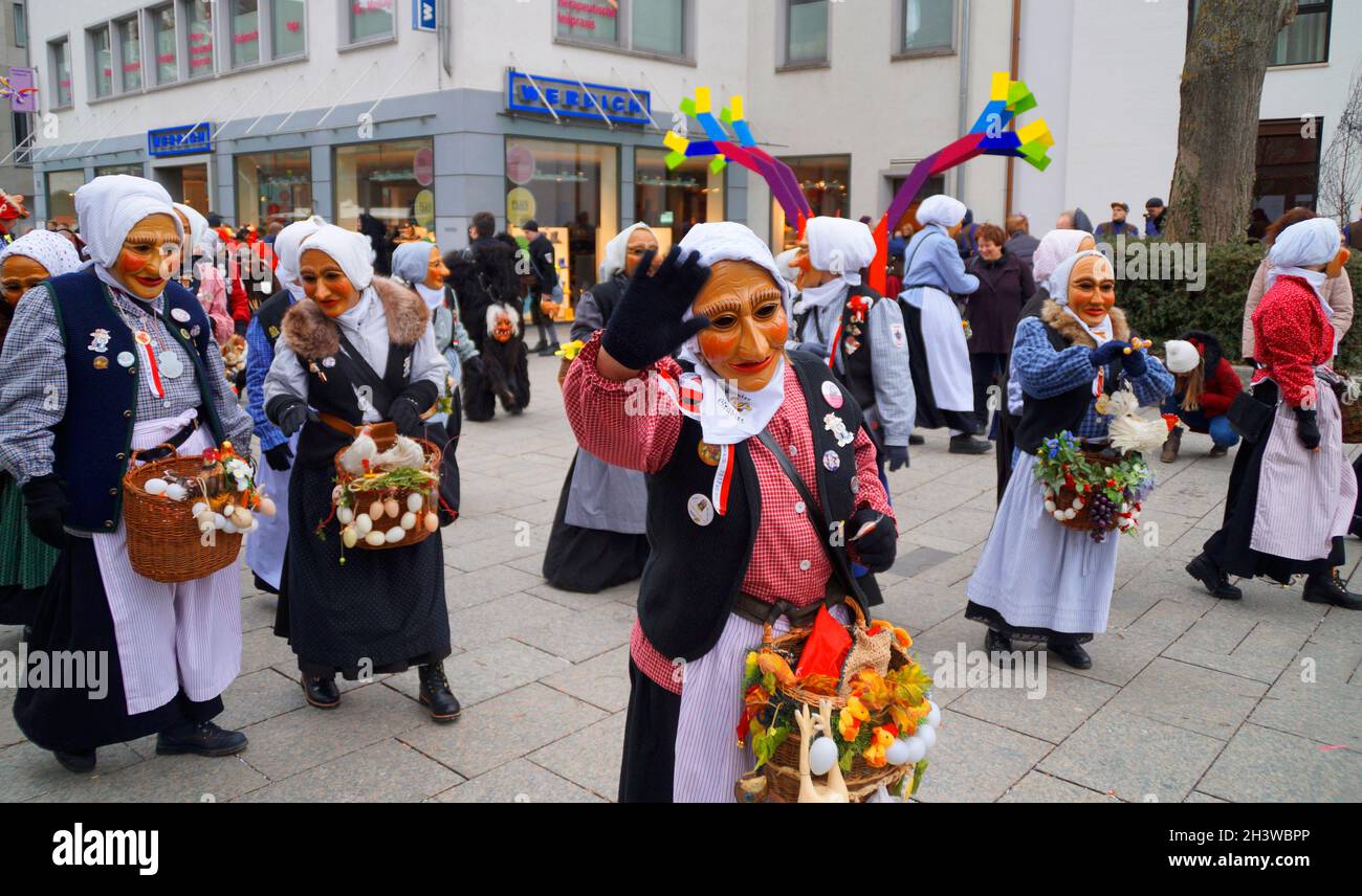 people dressed up in funny clothes and masks celebrating traditional ...