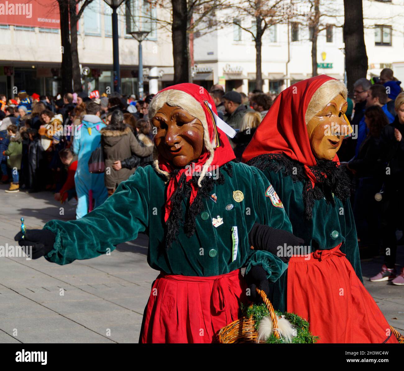 people dressed up in funny clothes and masks celebrating traditional ...