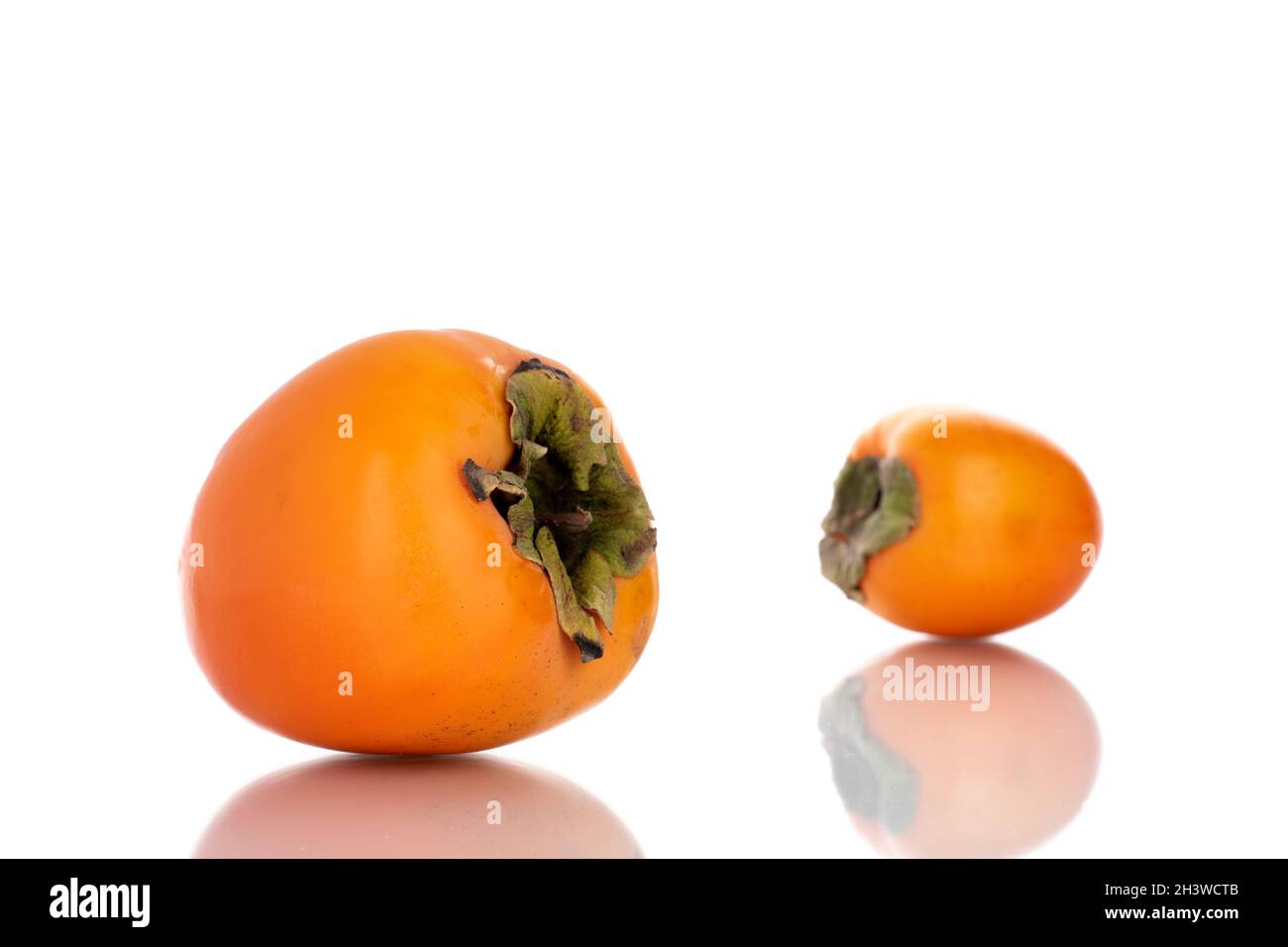 Two ripe sweet persimmons, close-up, isolated on white Stock Photo - Alamy