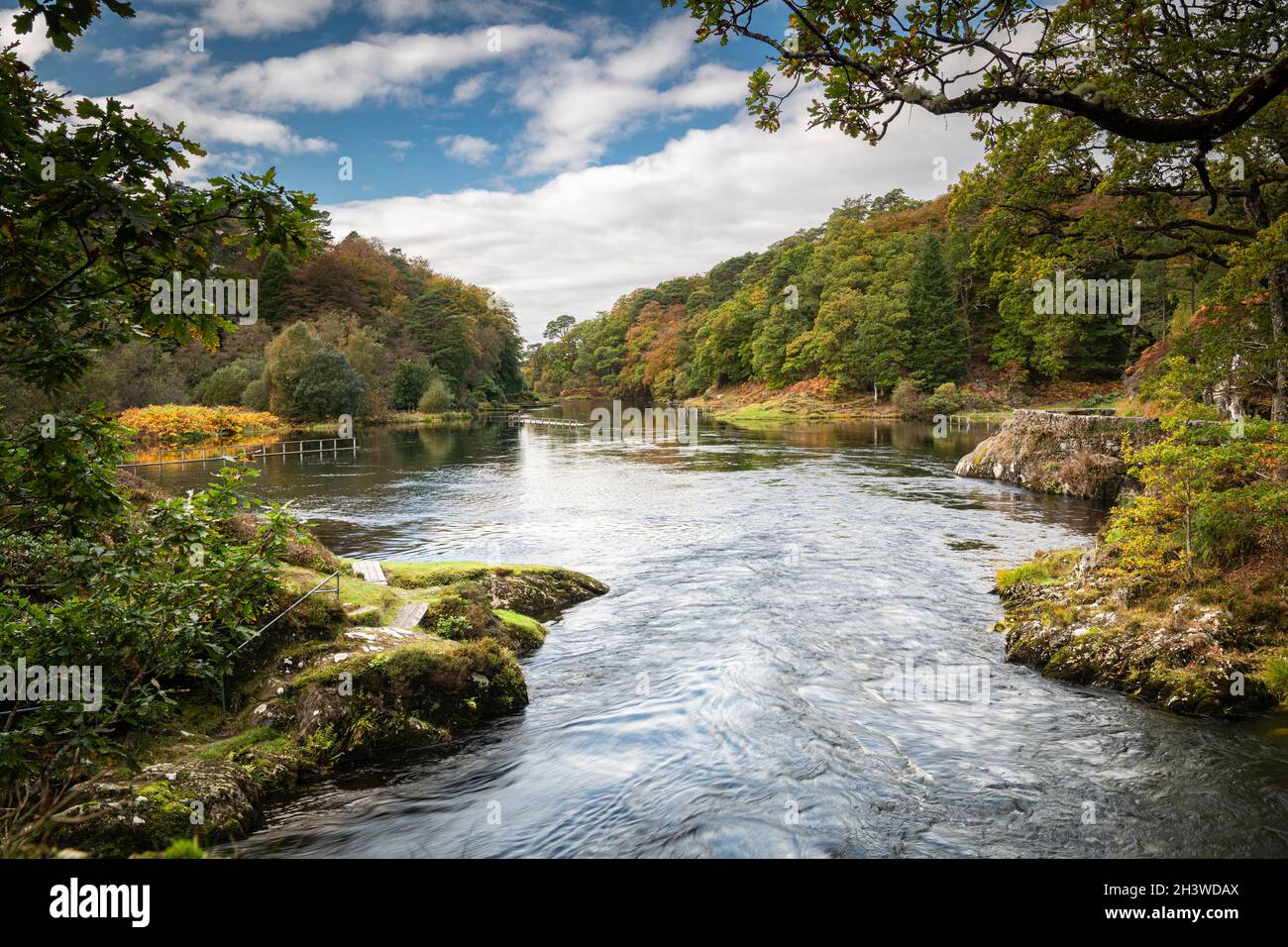A bright autumnal 3 shot HDR image of the River Shiel in flood near ...