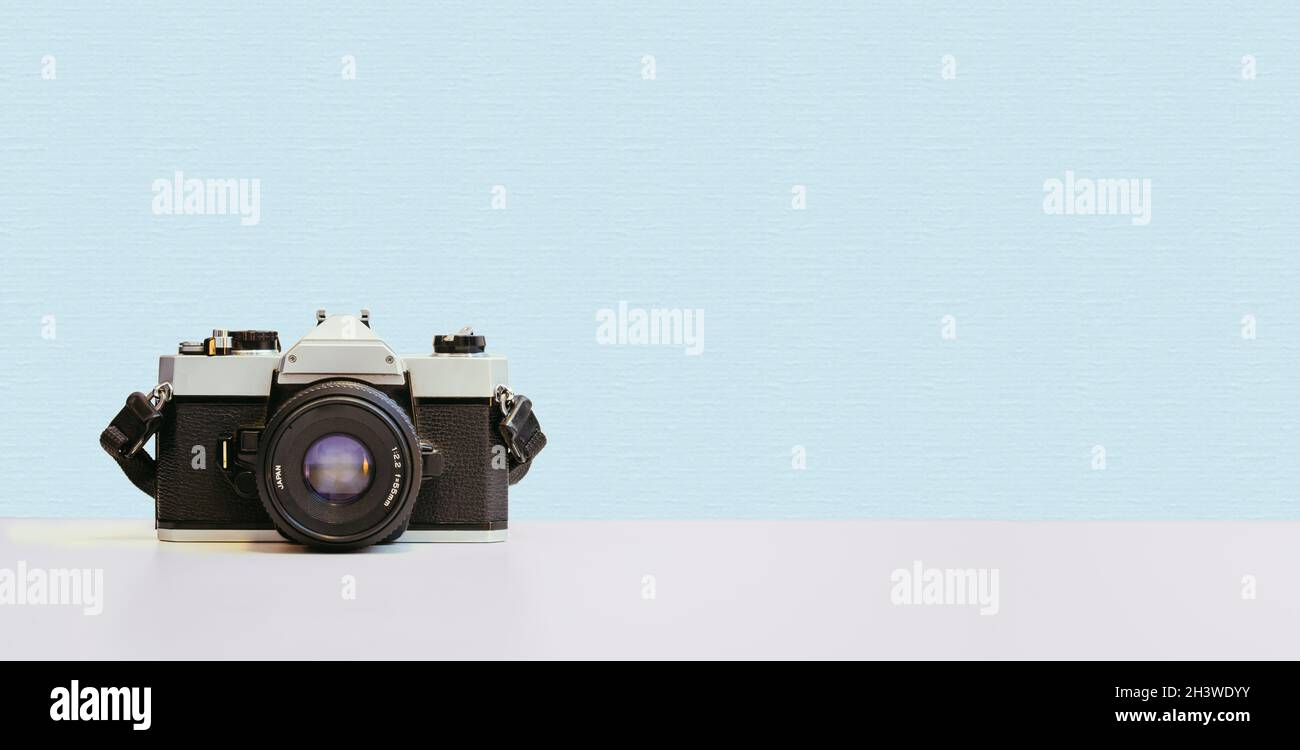 Vintage photography camera on blue colored background, retro Stock ...