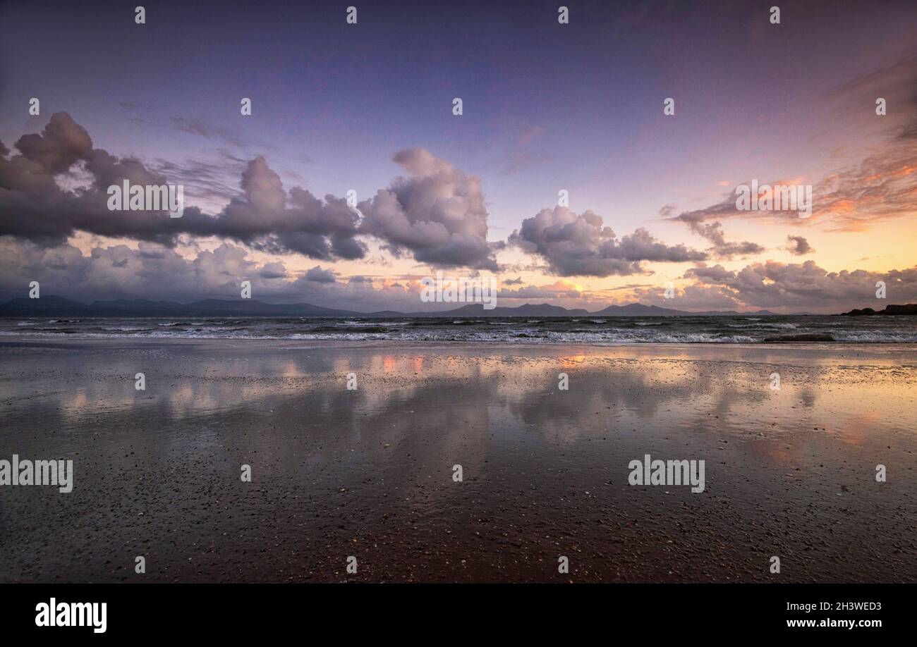 Sunset reflections at Traeth Llanddwyn, Anglesey Wales UK Stock Photo ...